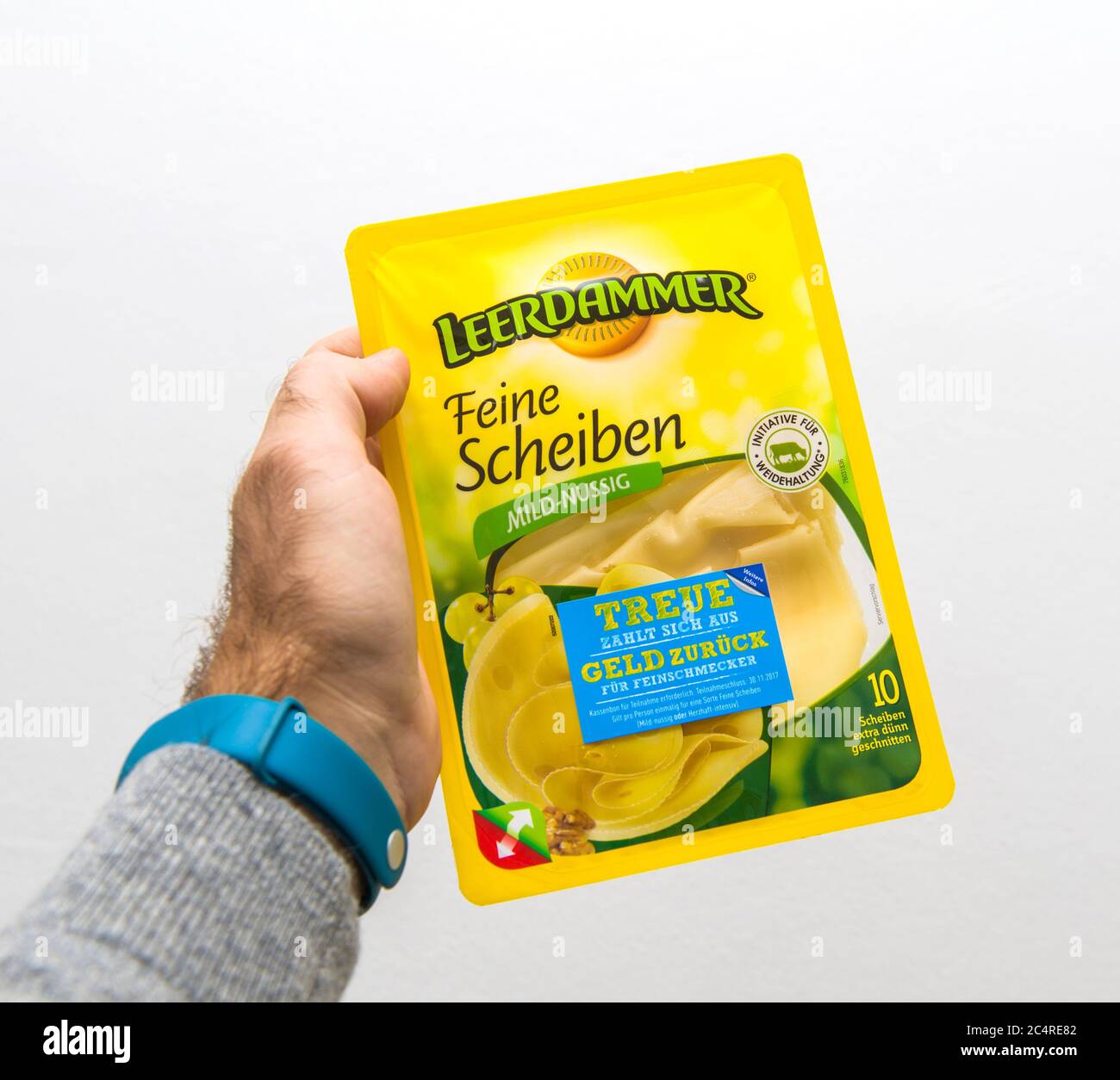 Munich, Germany - Oct 21, 2019: Male hand holding against white ...