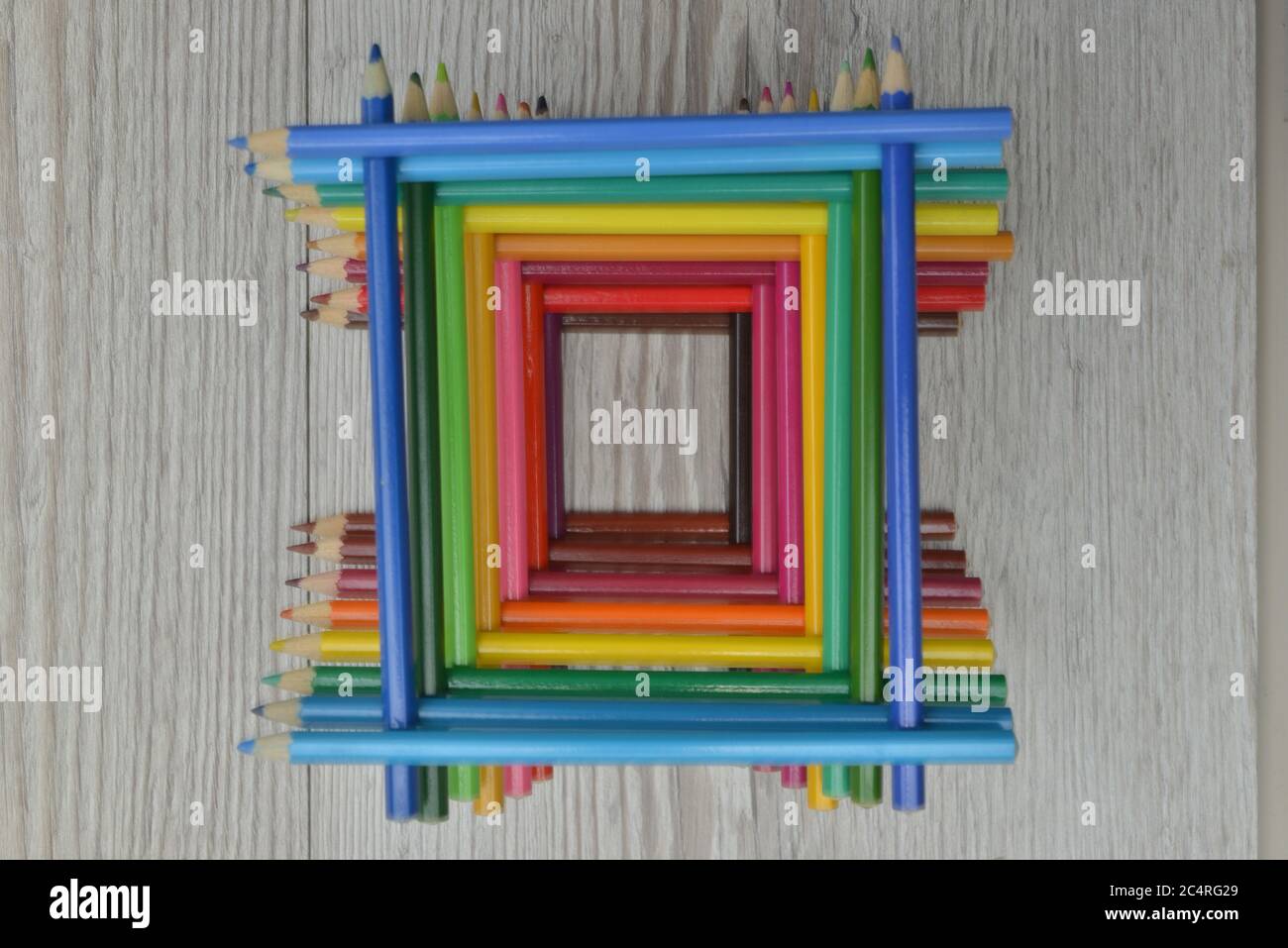 colored wooden pencils stacked in a pyramid. Colored pencils palette ...