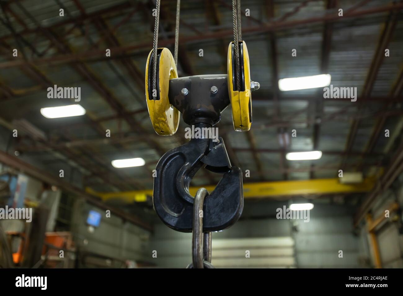 selective focus close up view of lifting hook with safety latch ...