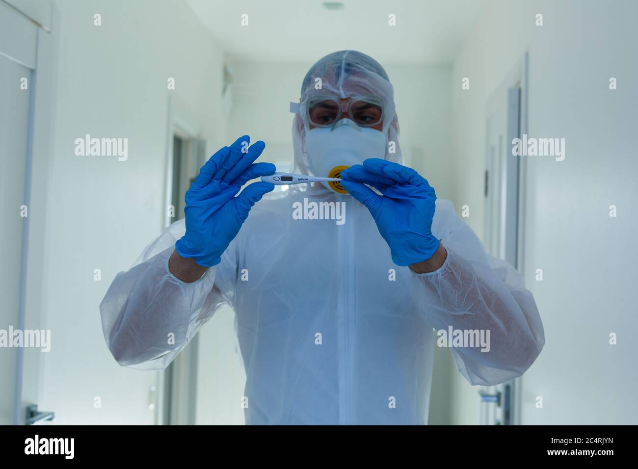 Scientist in protective gear with arms crossed in laboratory Stock ...