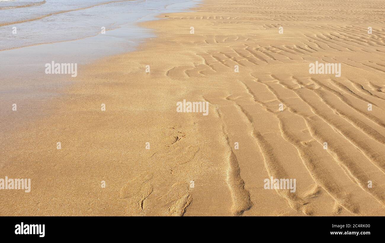 Sand patterns and sea Stock Photo - Alamy
