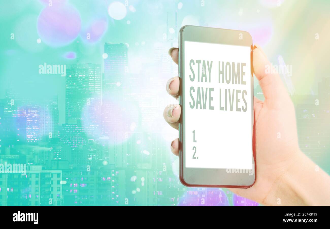 Writing note showing Stay Home Save Lives. Business concept for lessen ...