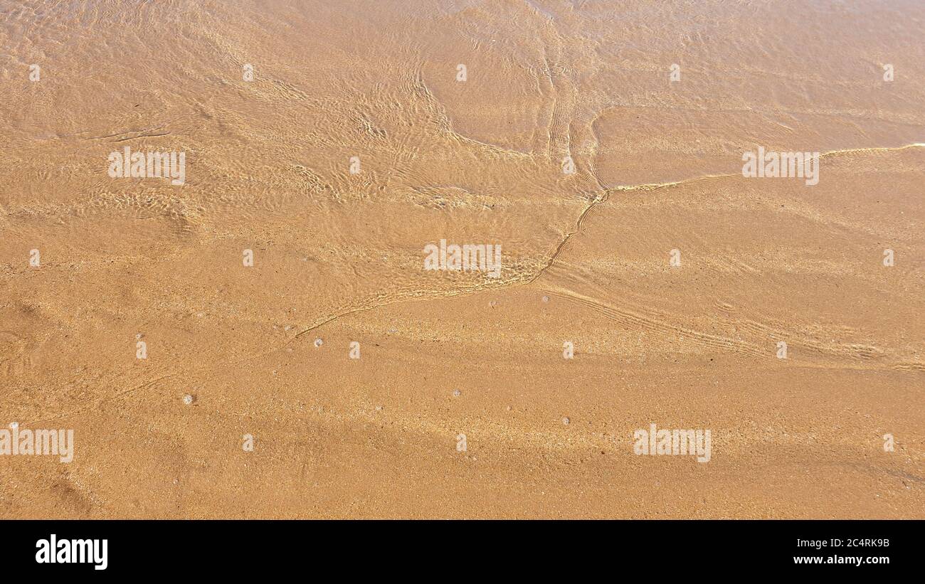 Sand patterns and sea Stock Photo - Alamy