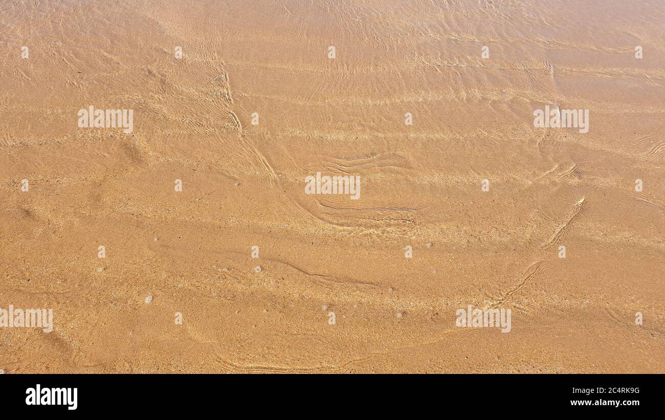 Sand patterns and sea Stock Photo - Alamy