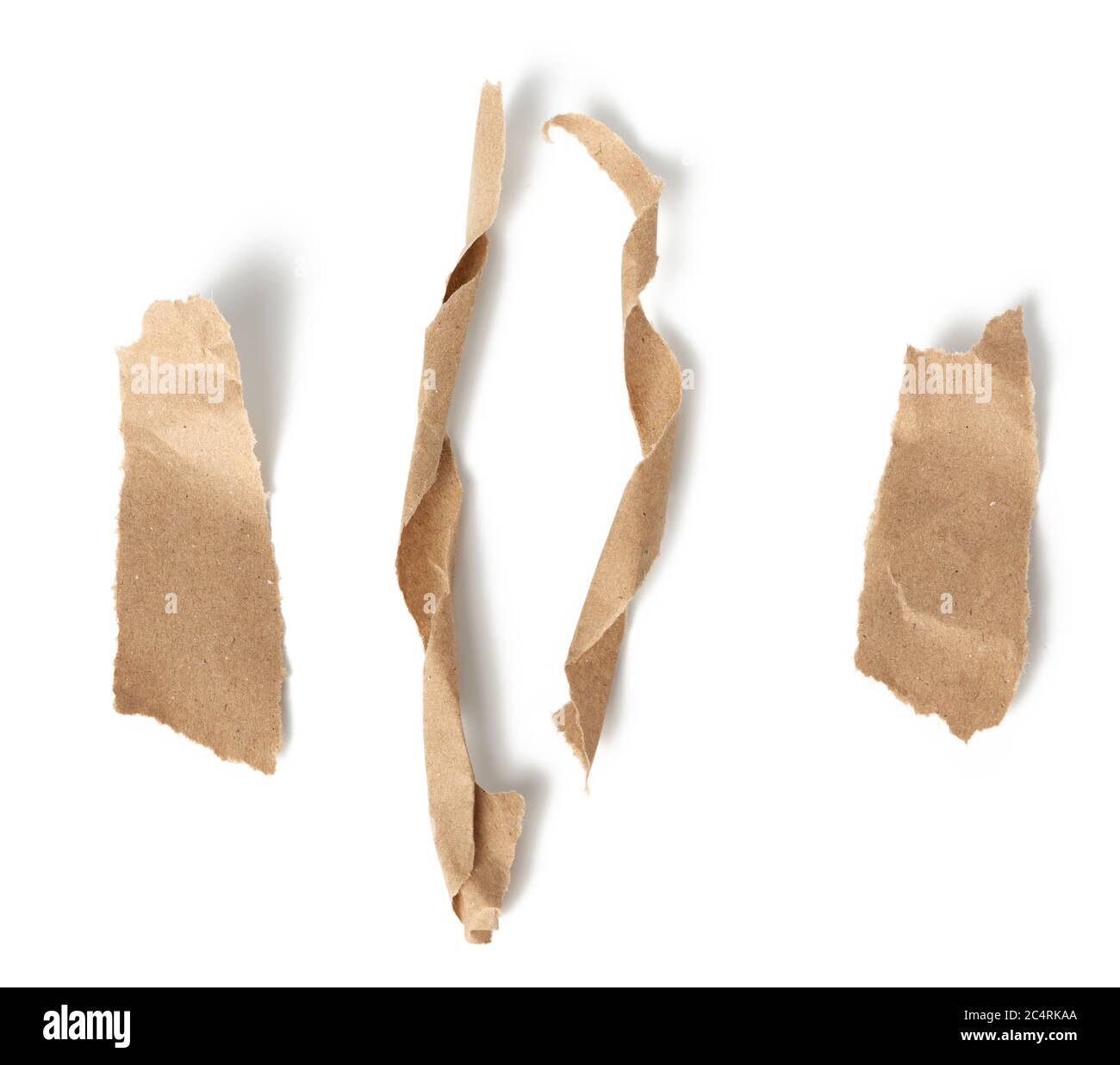 twisted brown paper strips and torn pieces isolated on white background ...