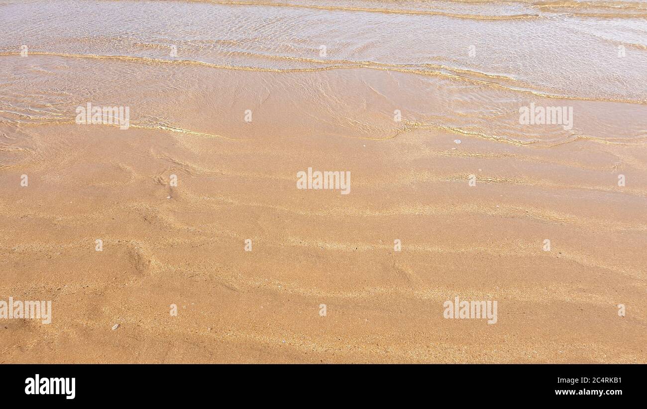 Sand patterns and sea Stock Photo - Alamy