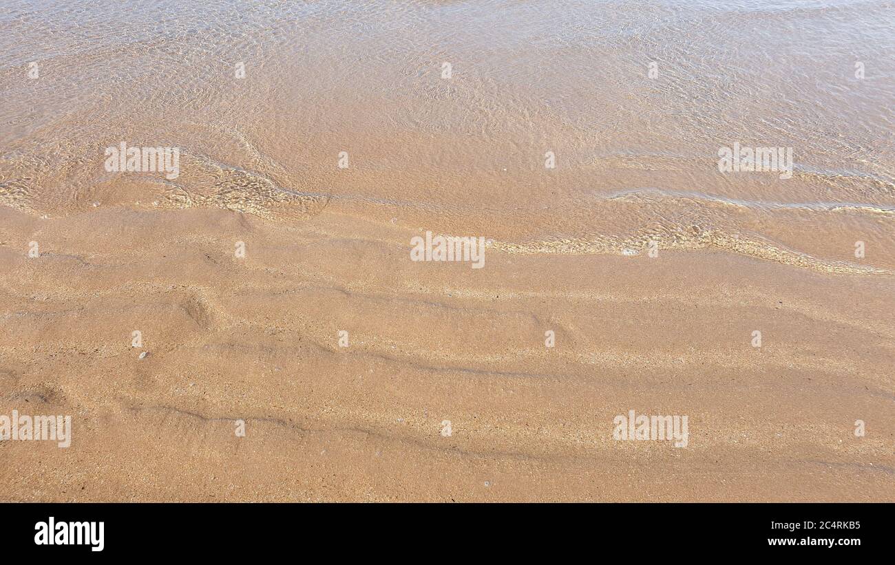 Sand patterns and sea Stock Photo - Alamy