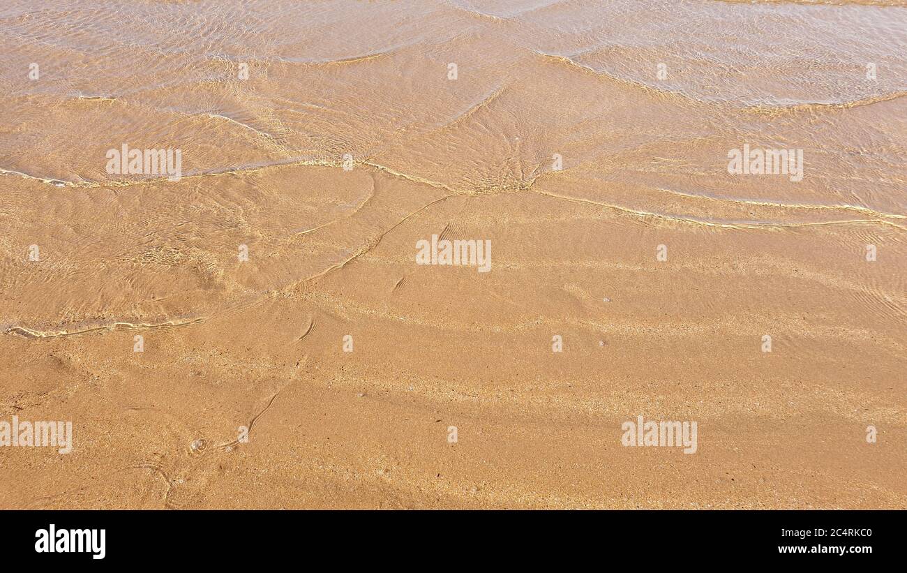 Sand patterns and sea Stock Photo - Alamy