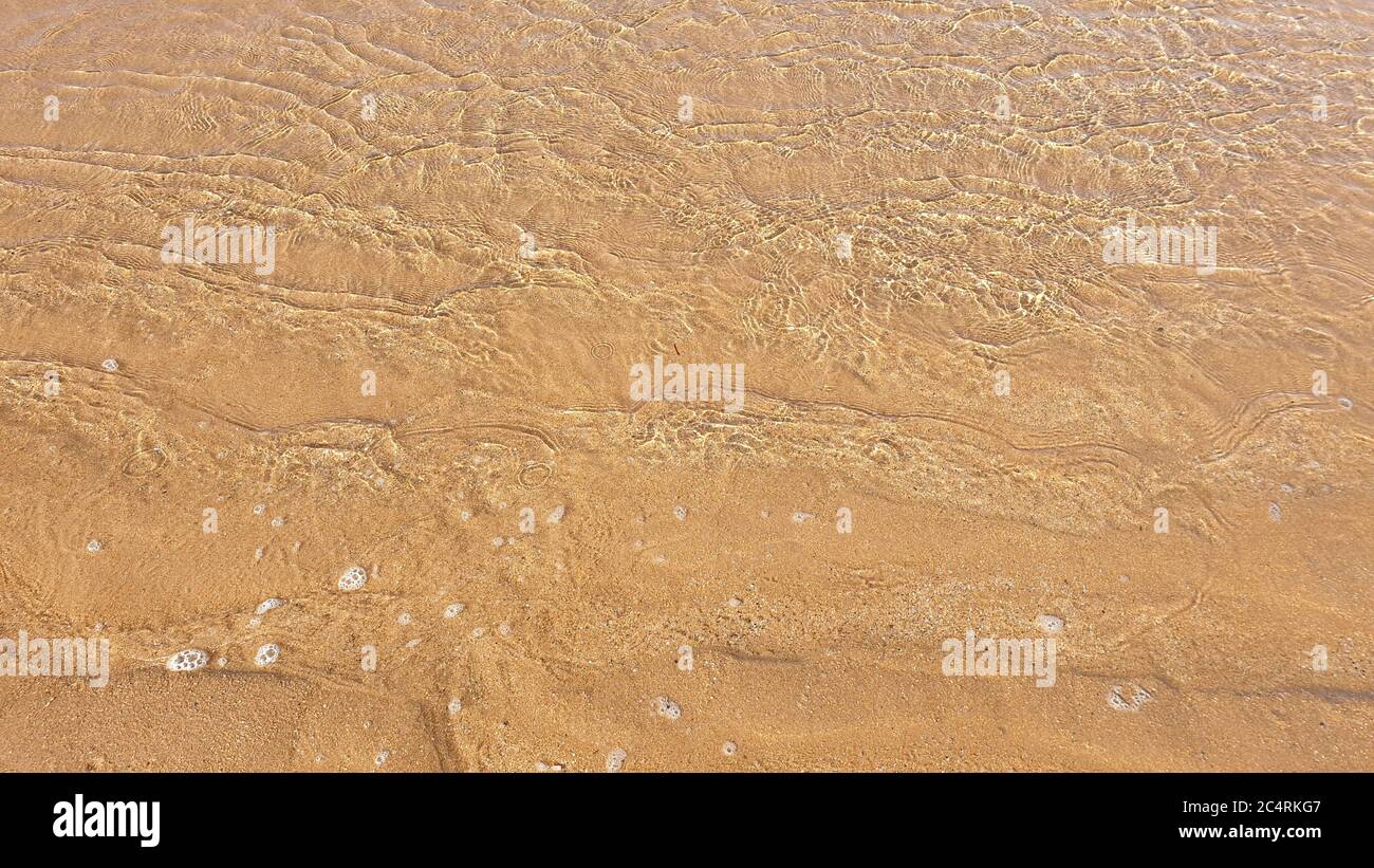 Sand patterns and sea Stock Photo - Alamy