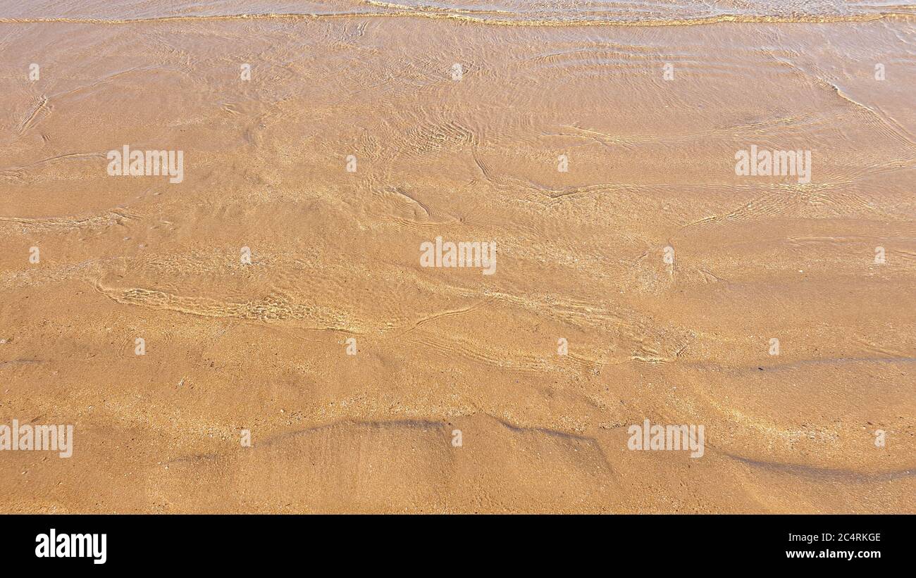 Sand patterns and sea Stock Photo - Alamy