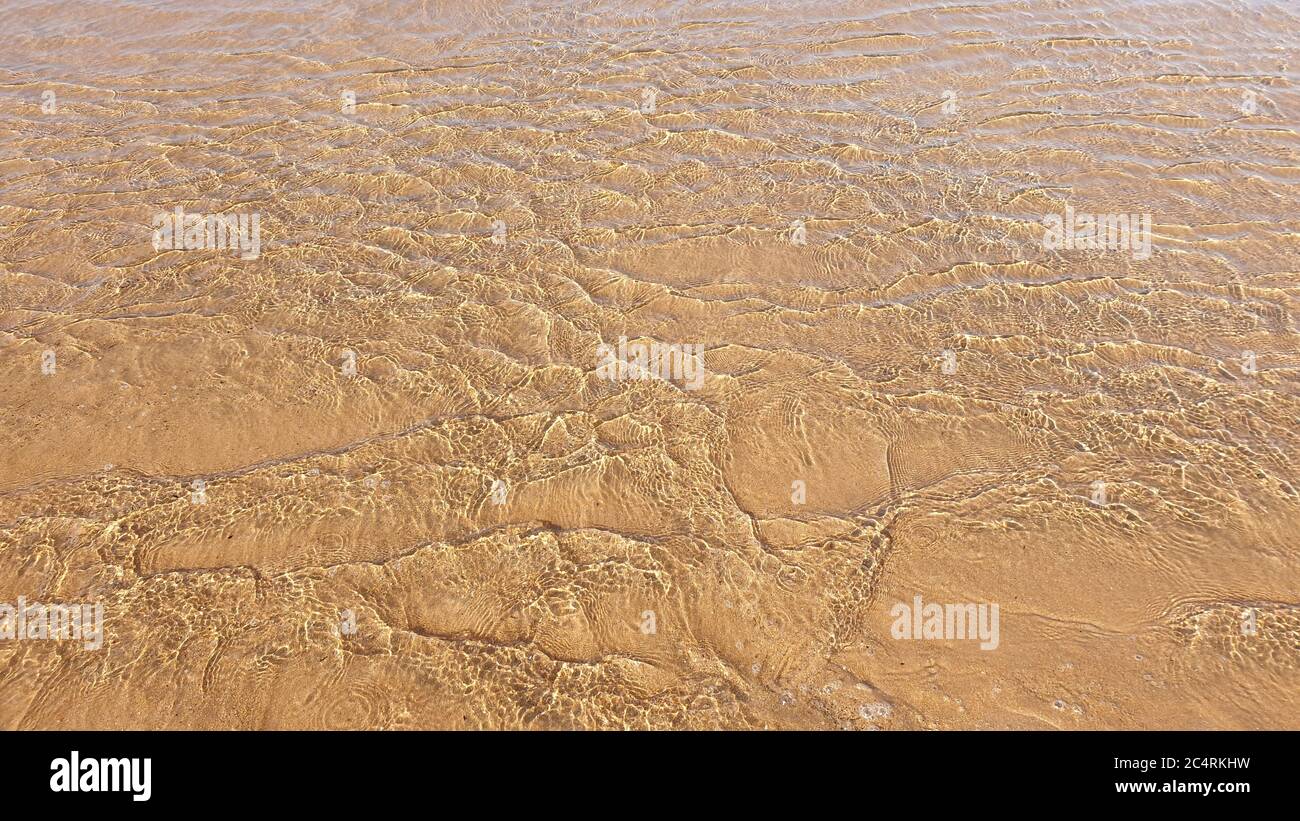 Sand patterns and sea Stock Photo - Alamy