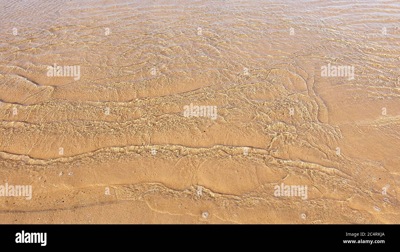 Sand patterns and sea Stock Photo - Alamy