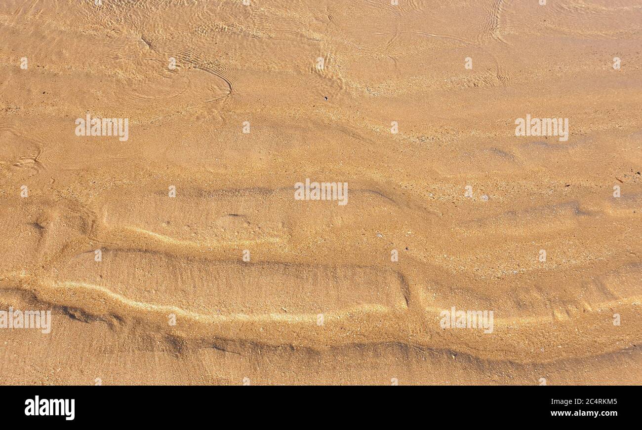 Sand patterns and sea Stock Photo - Alamy