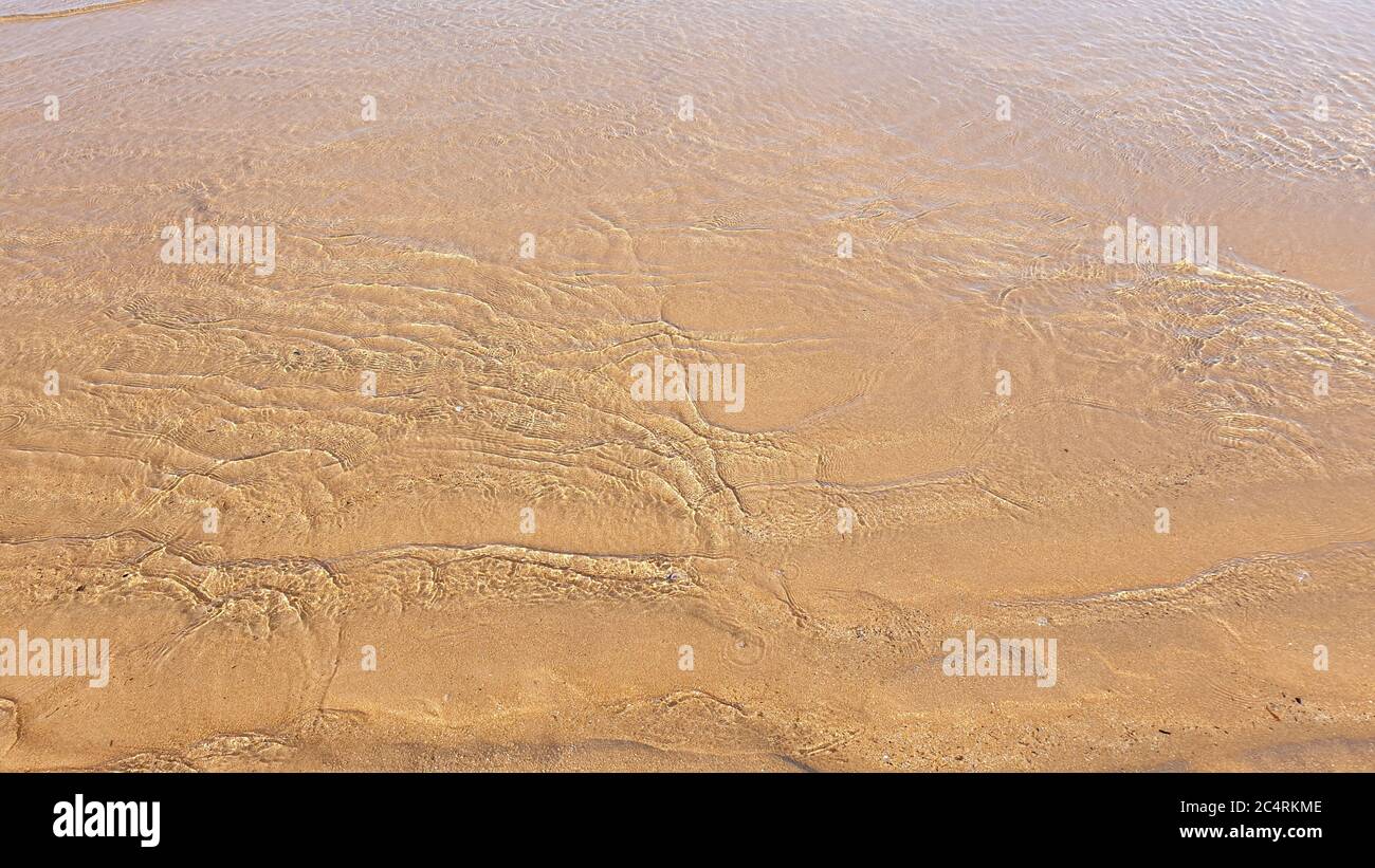 Sand patterns and sea Stock Photo - Alamy