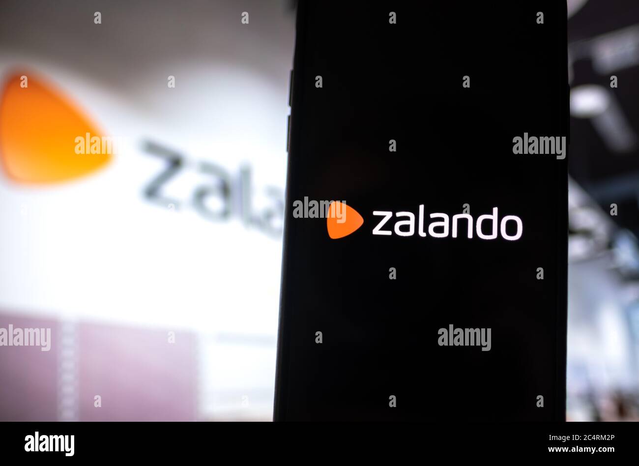 Zalando shop logo on the smartphone screen Stock Photo - Alamy