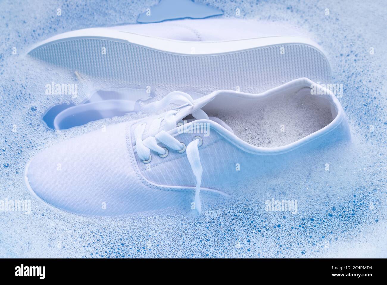 Soak shoes before washing. Cleaning Dirty sneakers Stock Photo - Alamy