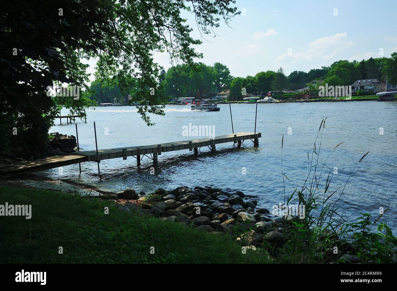 A dock jutting out into the Fox River in Northern Illinois, USA Stock ...