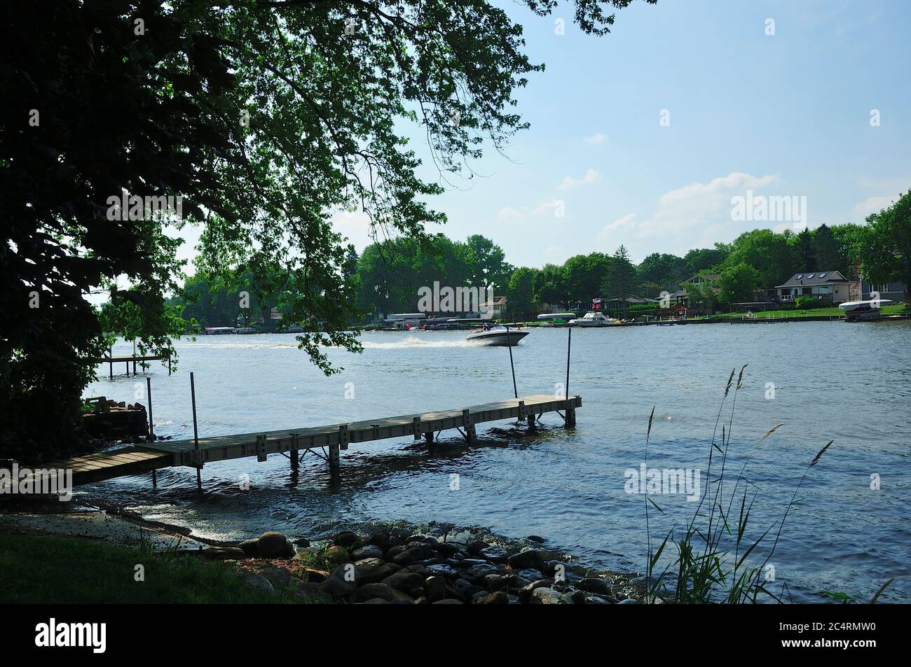 A dock jutting out into the Fox River in Northern Illinois, USA Stock ...