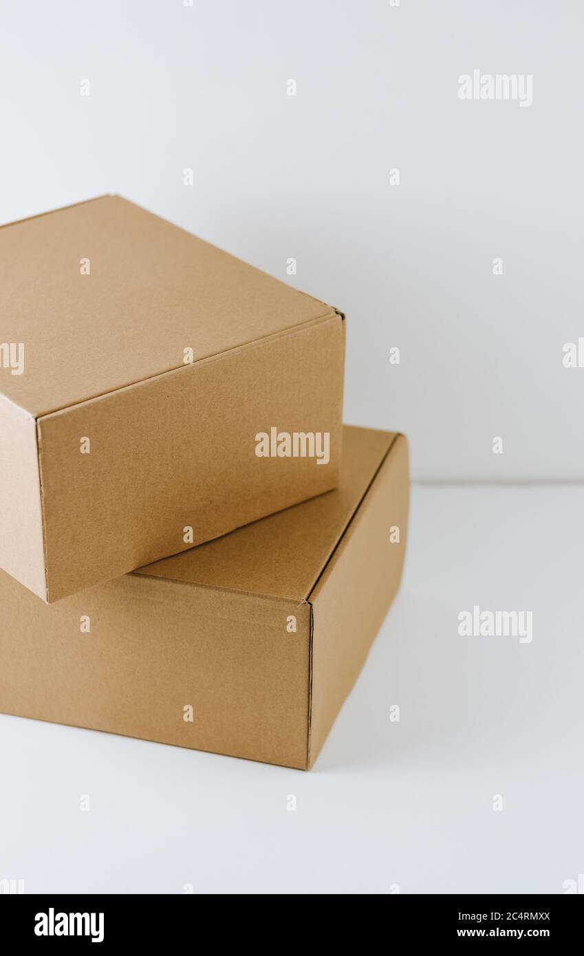 Cardboard boxes on white background Stock Photo - Alamy
