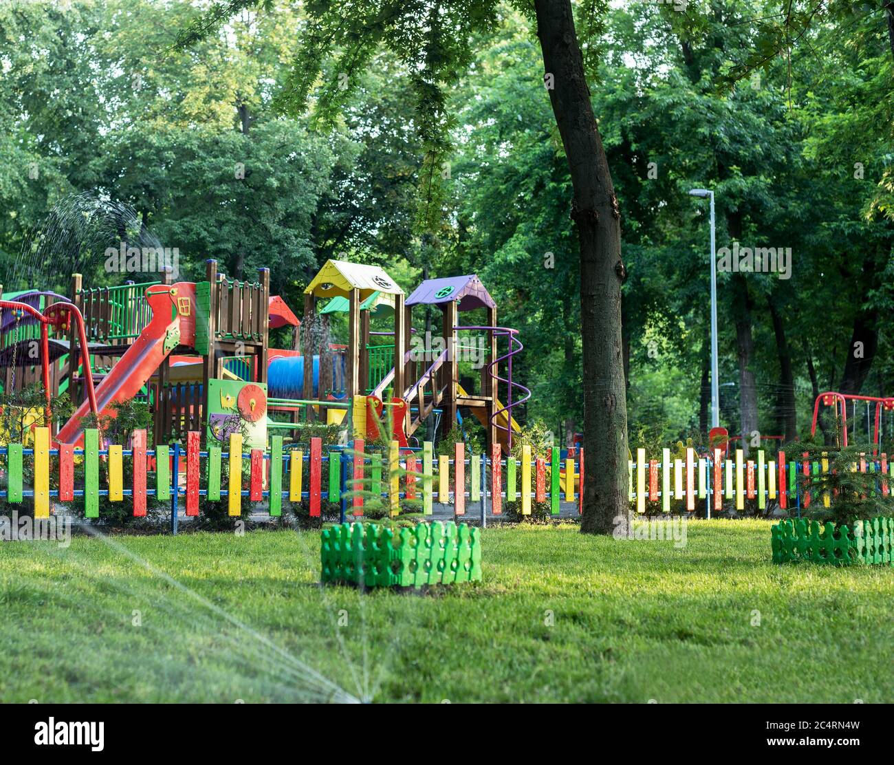 Colorful children playground in the park Stock Photo - Alamy