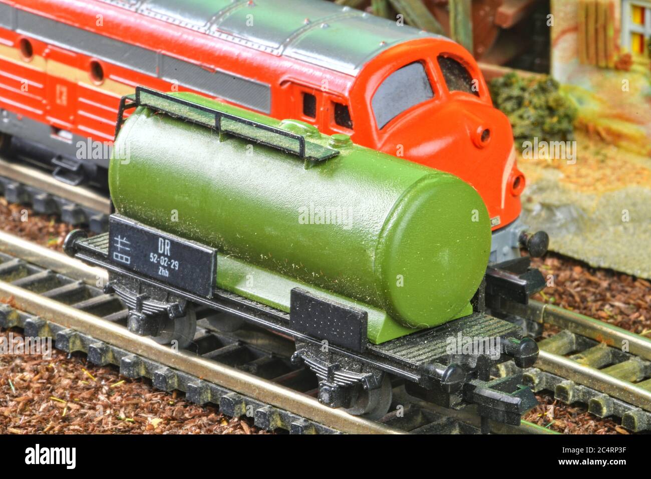 Railway tanker truck. Train hobby model on the model railway. Close-up ...