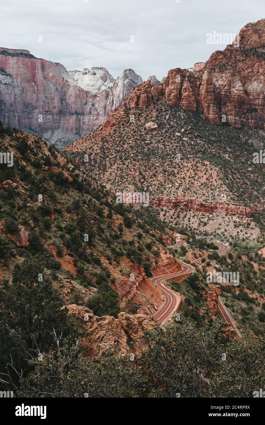Winding road and steep red cliffs of Zion Canyon, Utah Stock Photo - Alamy