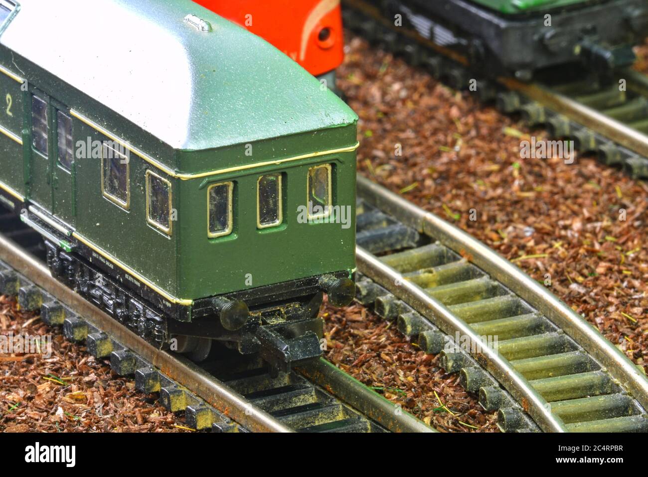 Close-up of model railway carriage on the rail tracks. Perfect model of ...