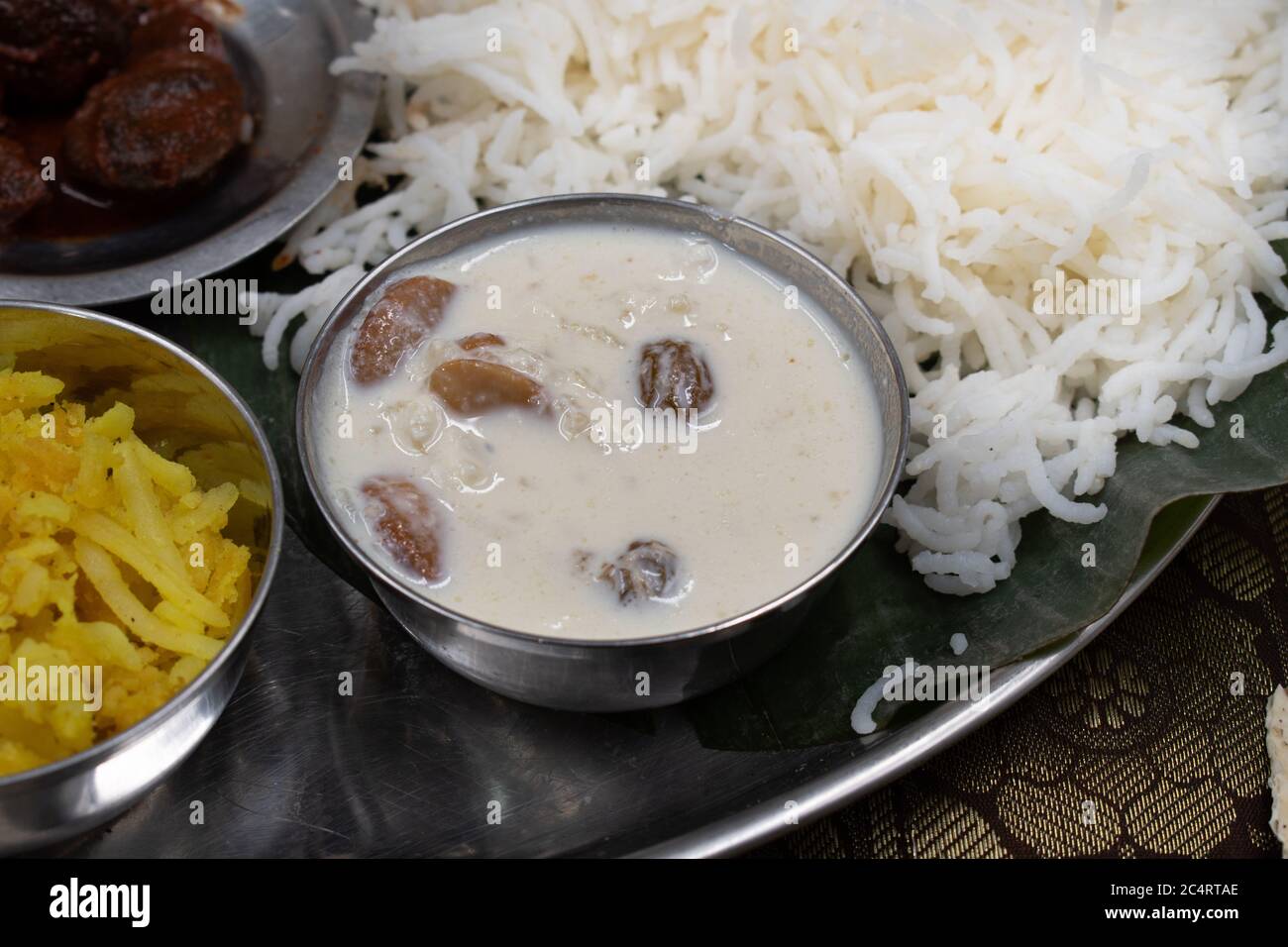 Indian milk pudding served on thali platter Stock Photo - Alamy