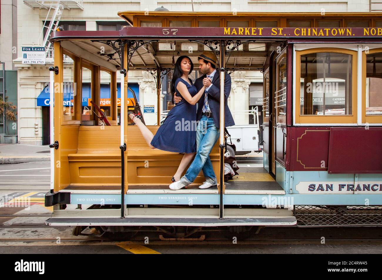 Couple dancing on a cable car in San Francisco Stock Photo - Alamy