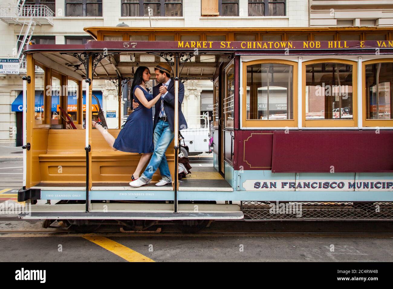 millenial couple dancing on a cable car in San Francisco Stock Photo ...