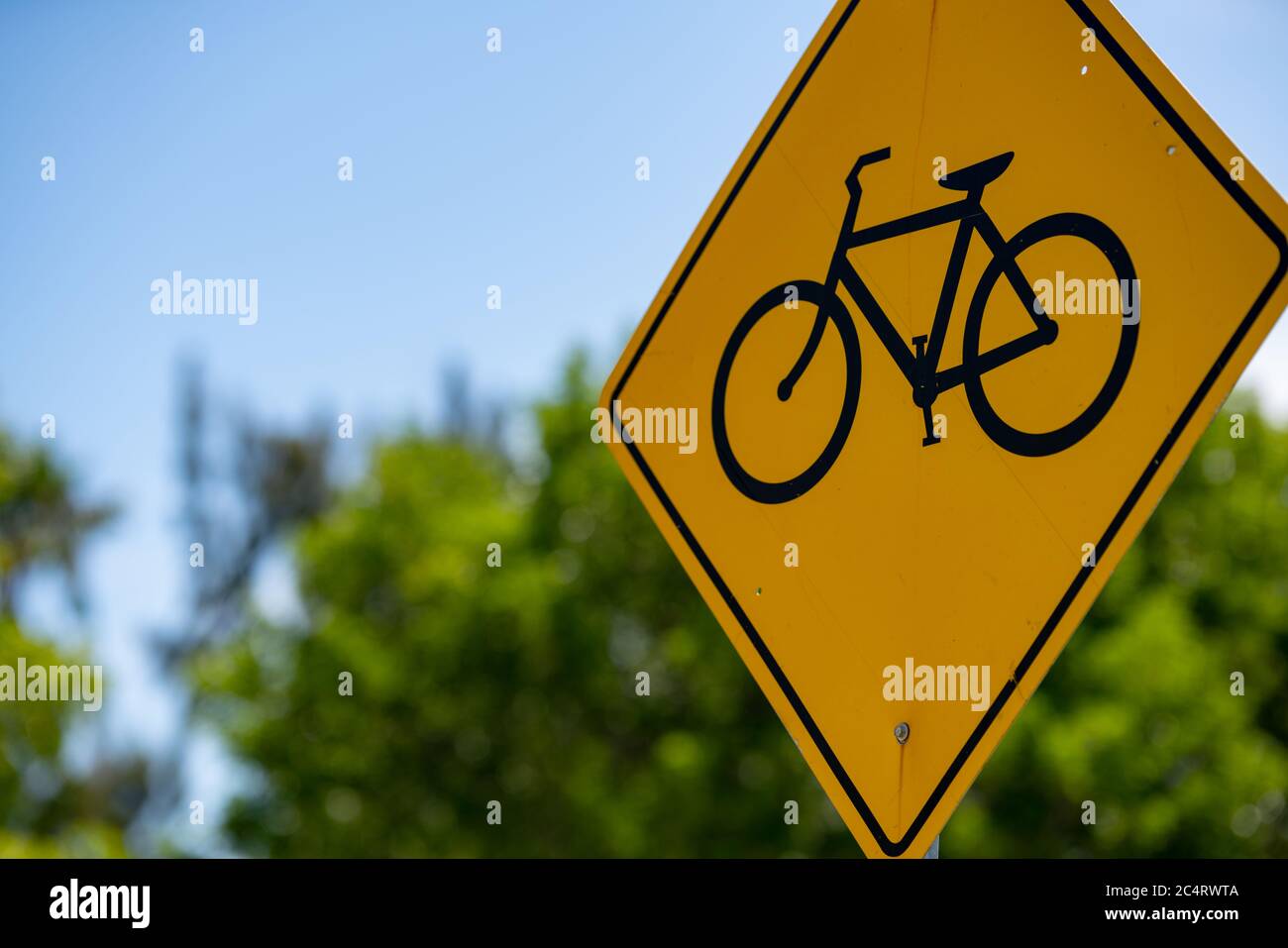 Bike crossing road street sign Stock Photo - Alamy