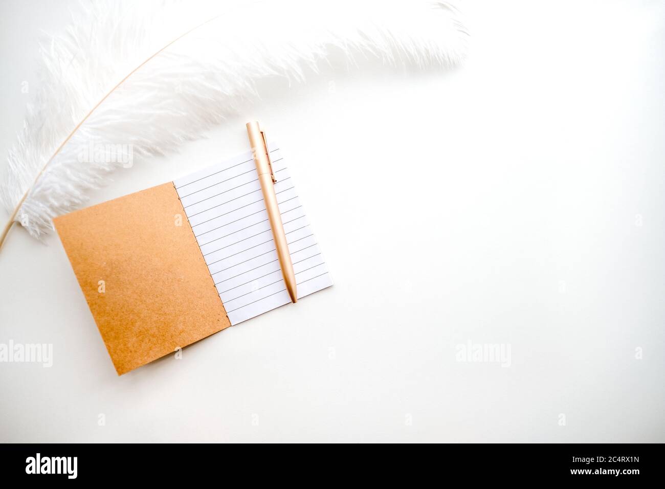 Notebook with a blank white striped sheet Stock Photo - Alamy