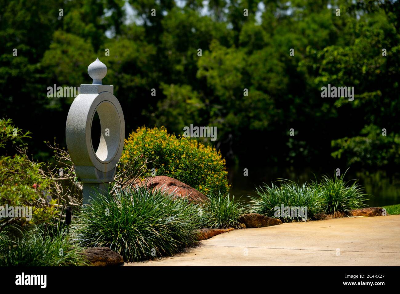 Photo outdoor garden pathway with memorial stone Stock Photo - Alamy