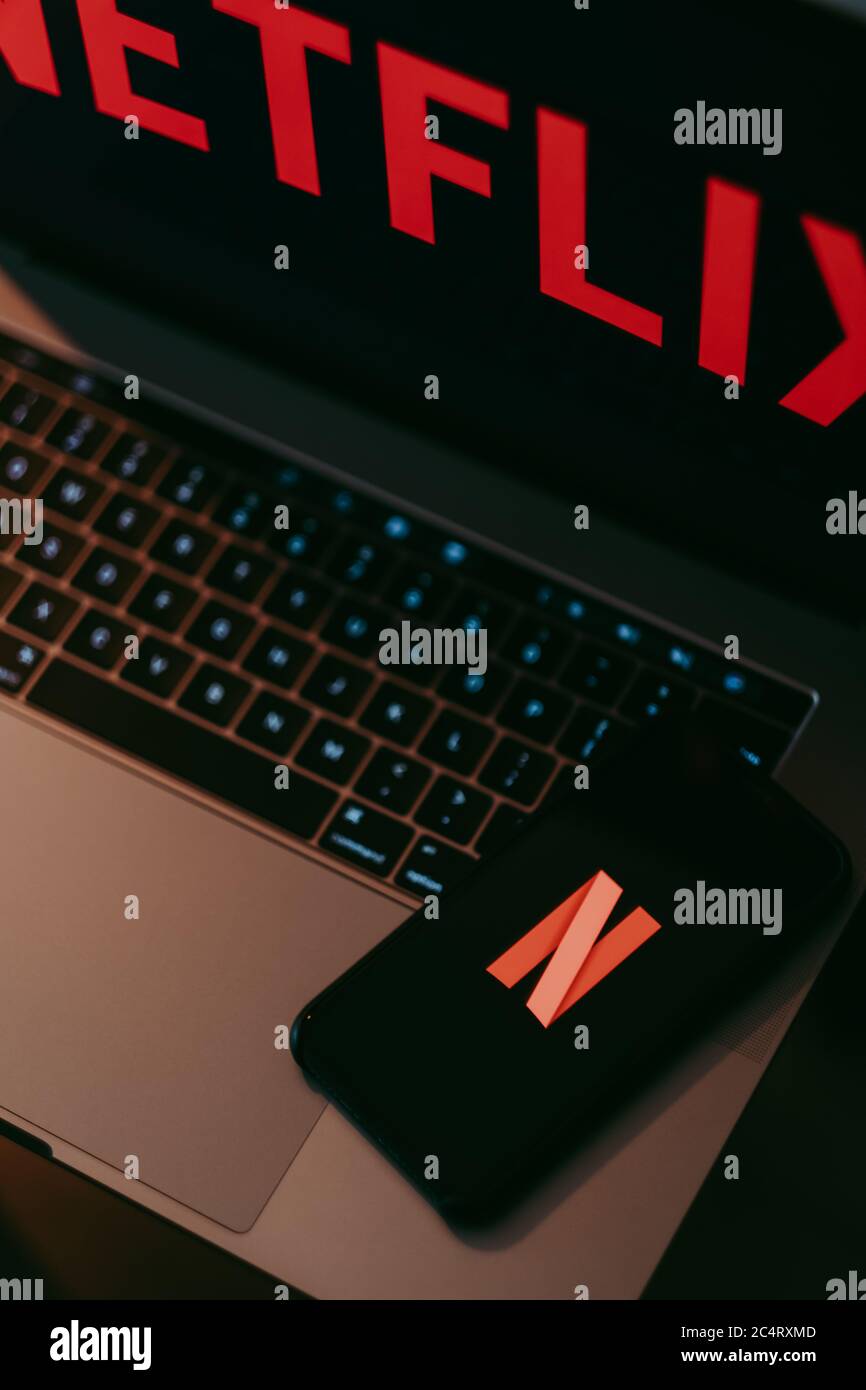 Smartphone and laptop with screen of Netflix logo Stock Photo - Alamy