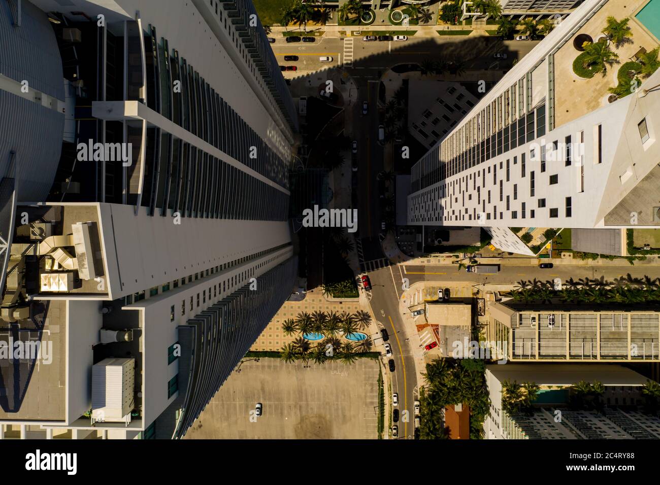 Aerial photo building shadow looming over a city street Stock Photo - Alamy
