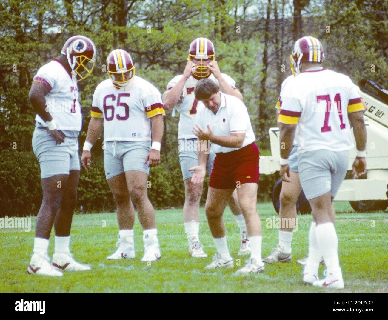 Washington Redskins offensive line coach Joe Bugel shows technique to ...