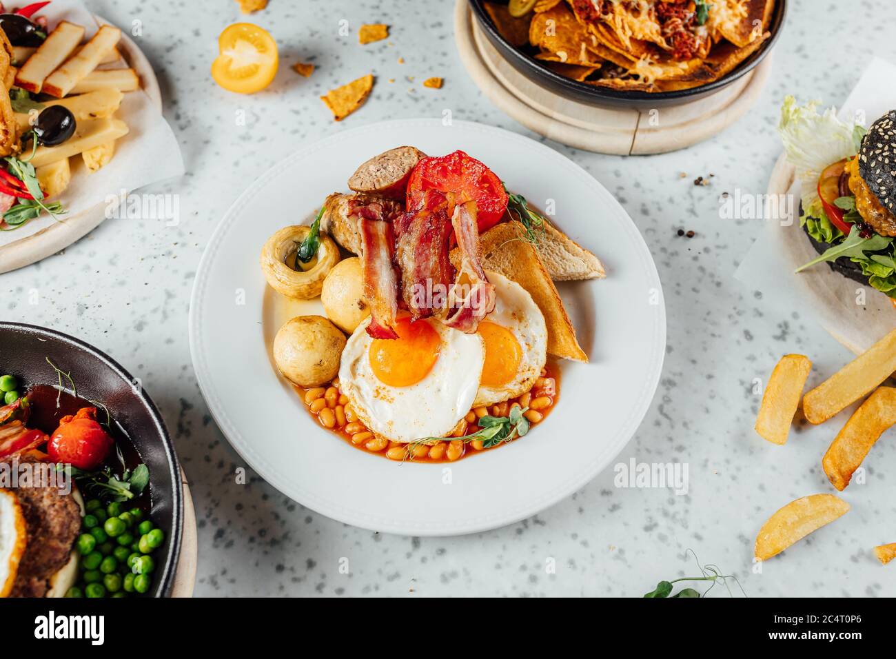 Overhead shot of a variety of fast food, meat, and snacks Stock Photo ...