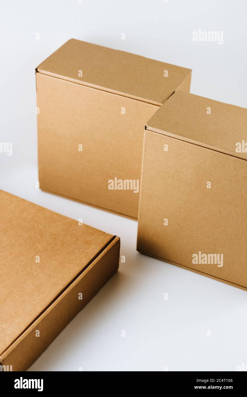 Cardboard boxes on white background Stock Photo - Alamy