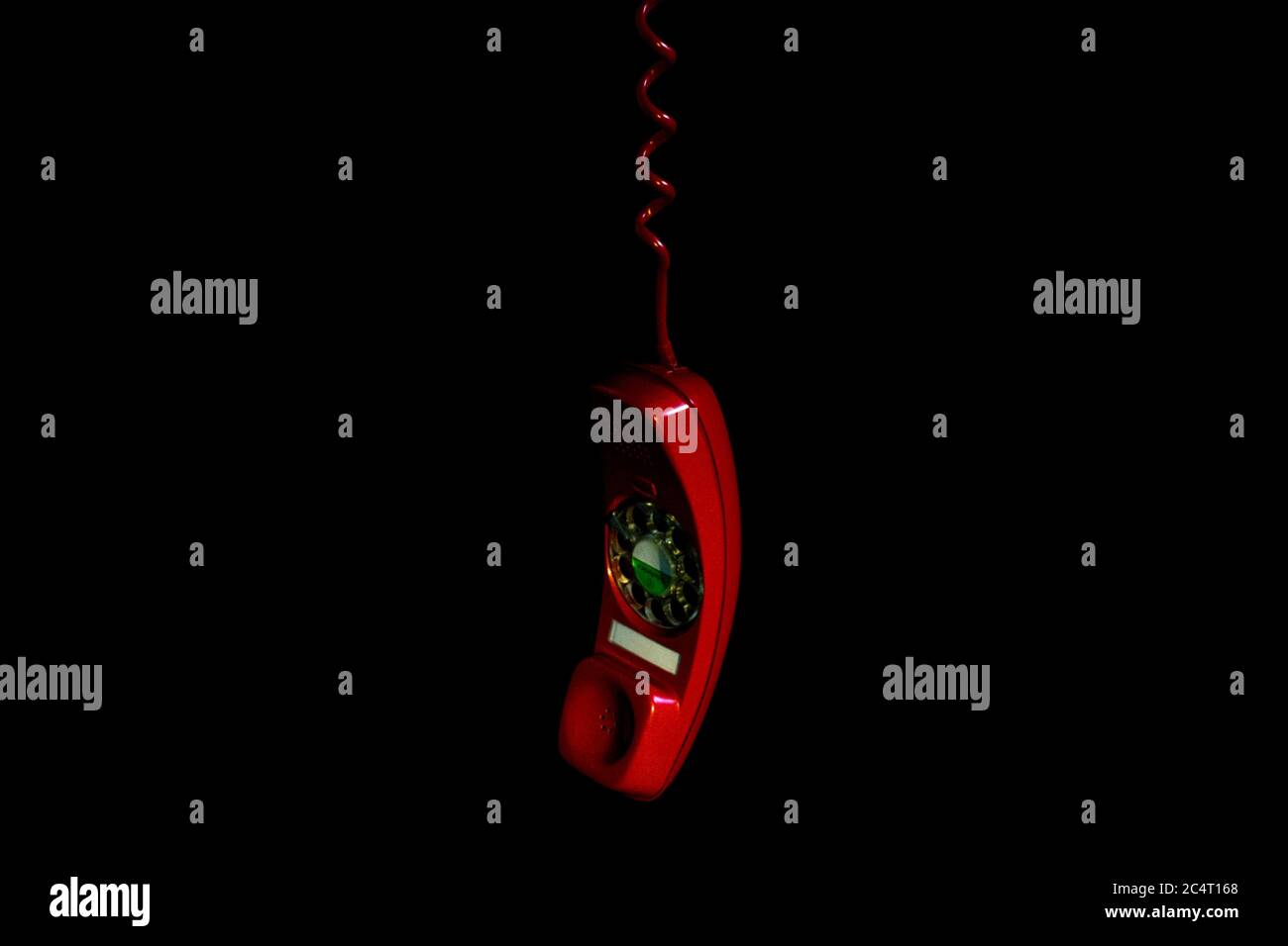Red telephone receiver hanging hi-res stock photography and images - Alamy