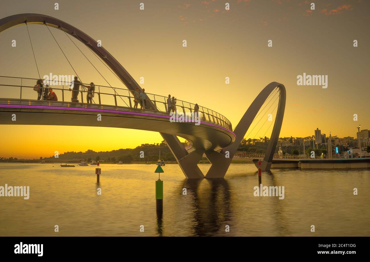 Twilight view along the Elizabeth Quay pedestrian bridge, Perth ...