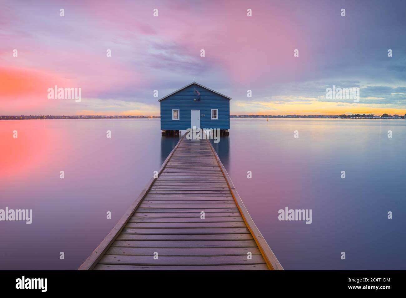 Dramatic sunrise over boathouse in the Swan River Perth, Australia ...
