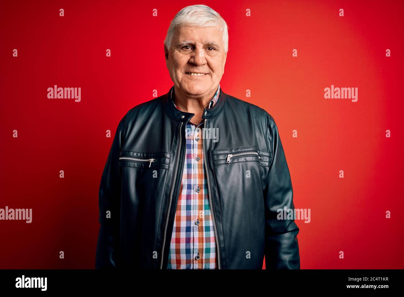 Senior handsome hoary man wearing casual shirt and jacket over isolated ...