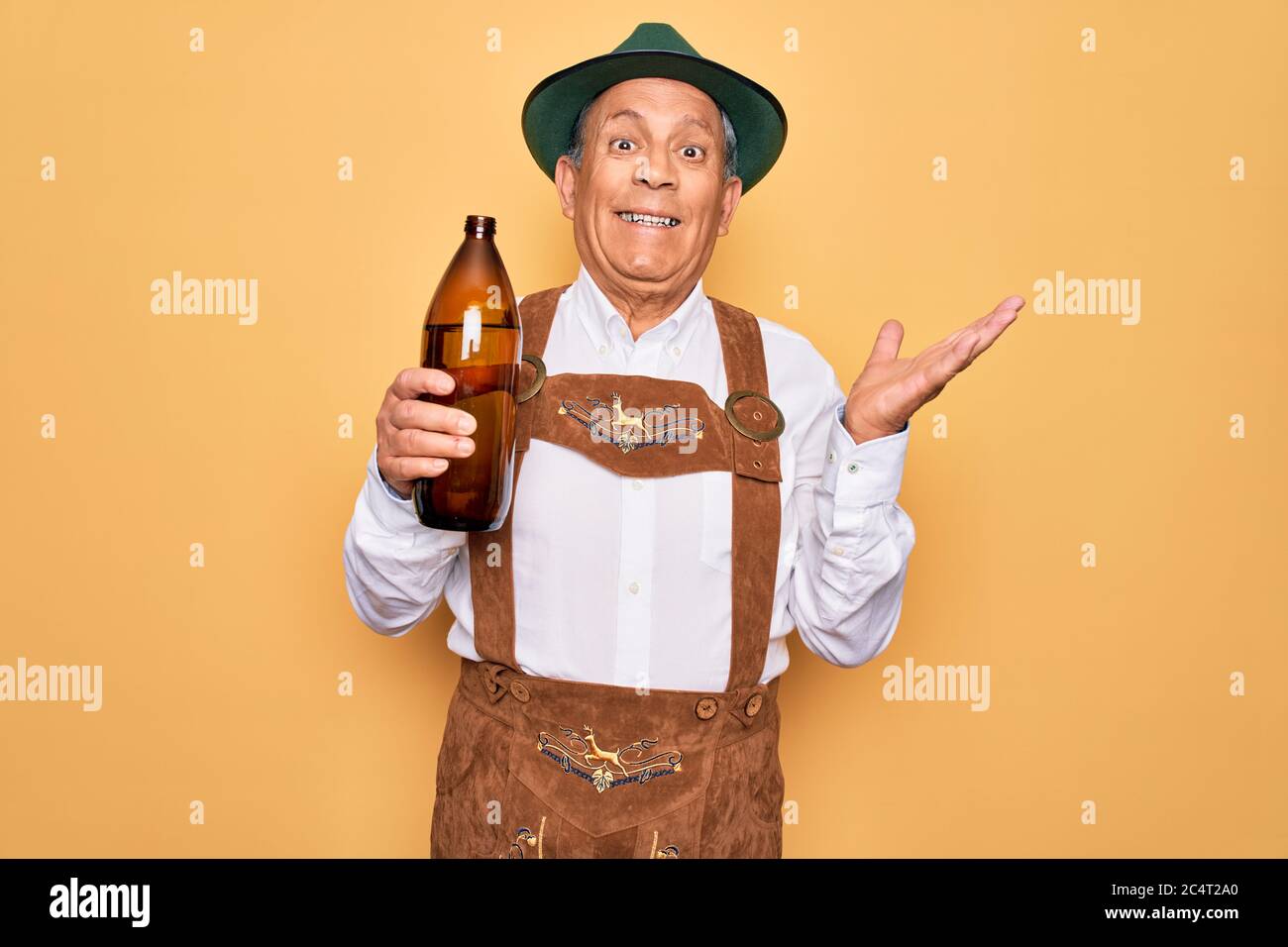Senior grey-haired man wearing german traditional octoberfest suit ...