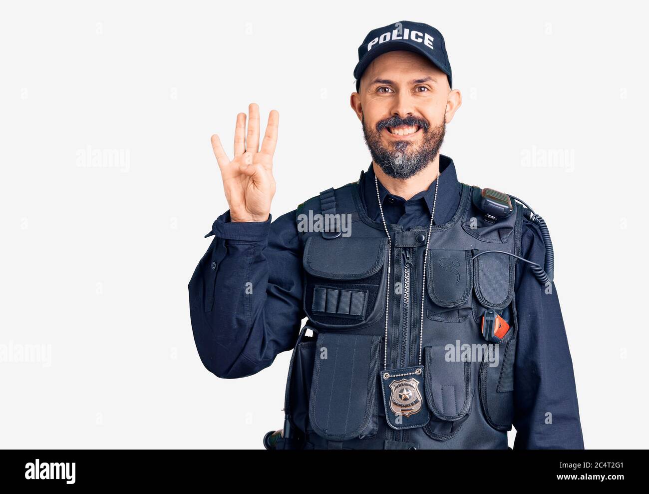 Young handsome man wearing police uniform showing and pointing up with ...