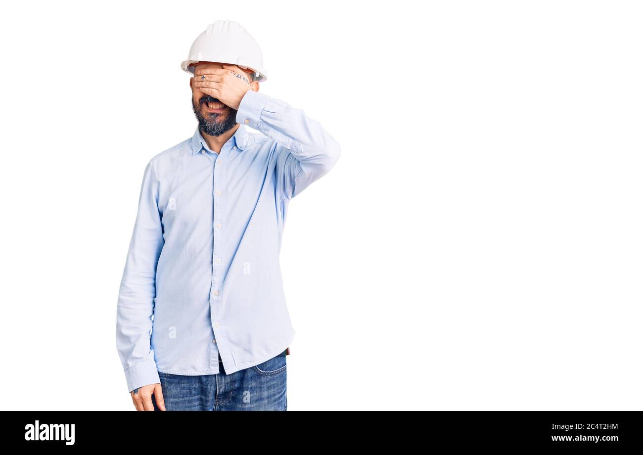 Young handsome man wearing architect hardhat smiling and laughing with ...
