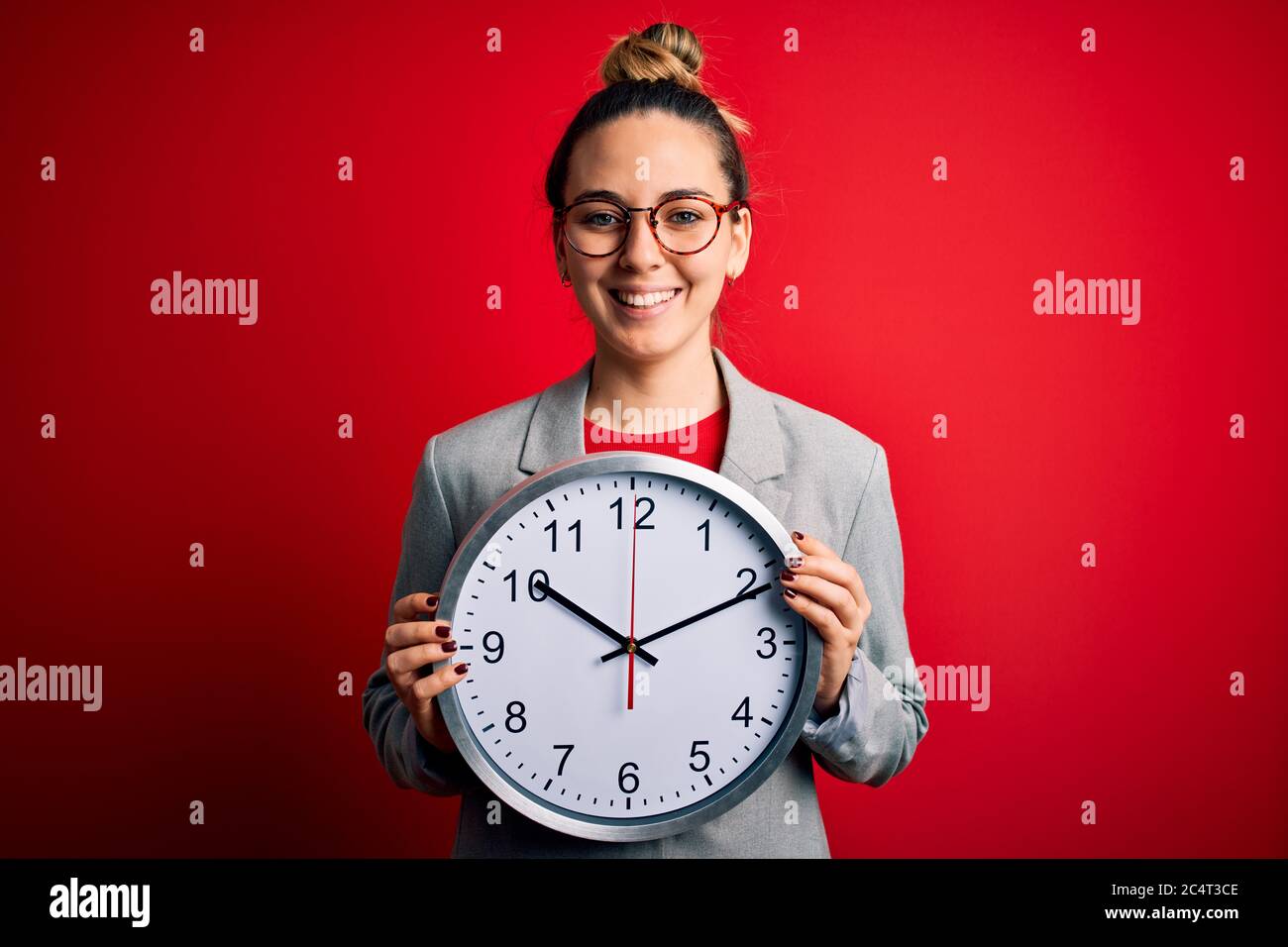 Beautiful blonde woman with blue eyes wearing glasses doing countdown ...