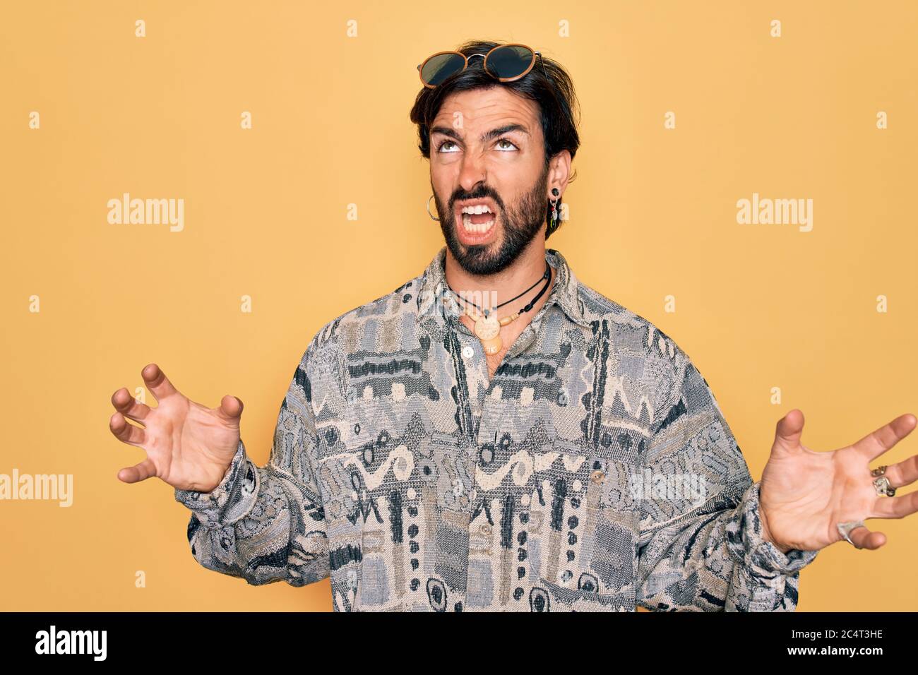 Young handsome hispanic bohemian man wearing hippie style and ...
