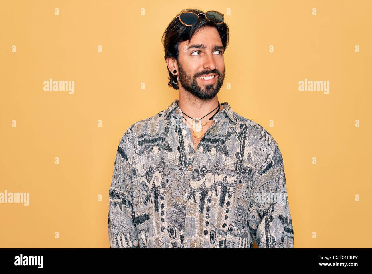 Young handsome hispanic bohemian man wearing hippie style and ...
