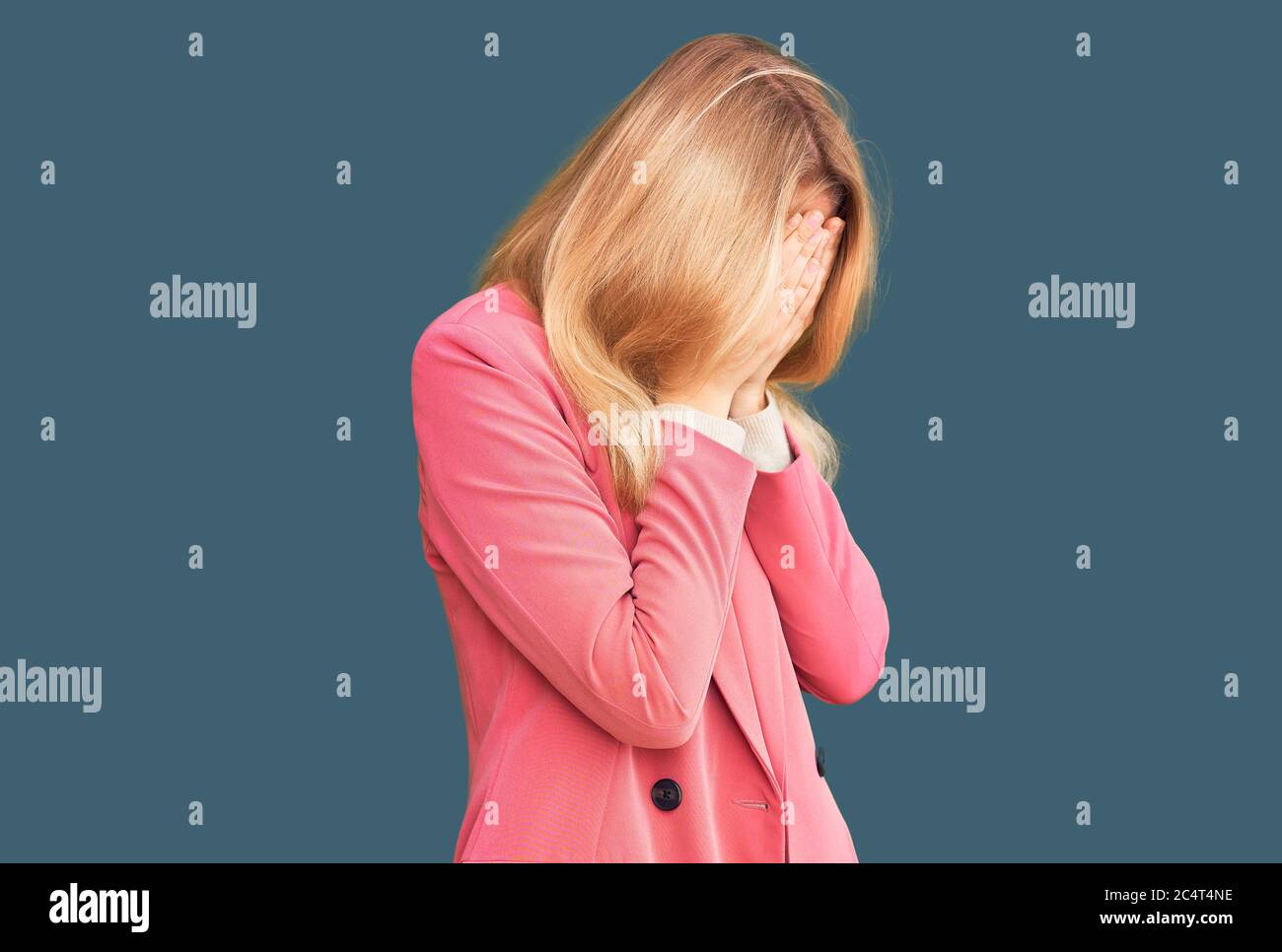 Young beautiful blonde woman wearing elegant clothes with sad ...
