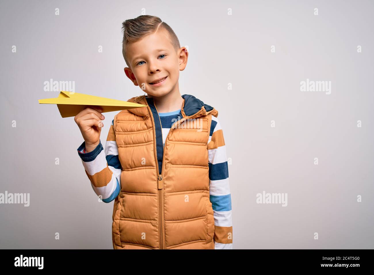 Young little caucasian kid having fun and playing imagination fly with ...
